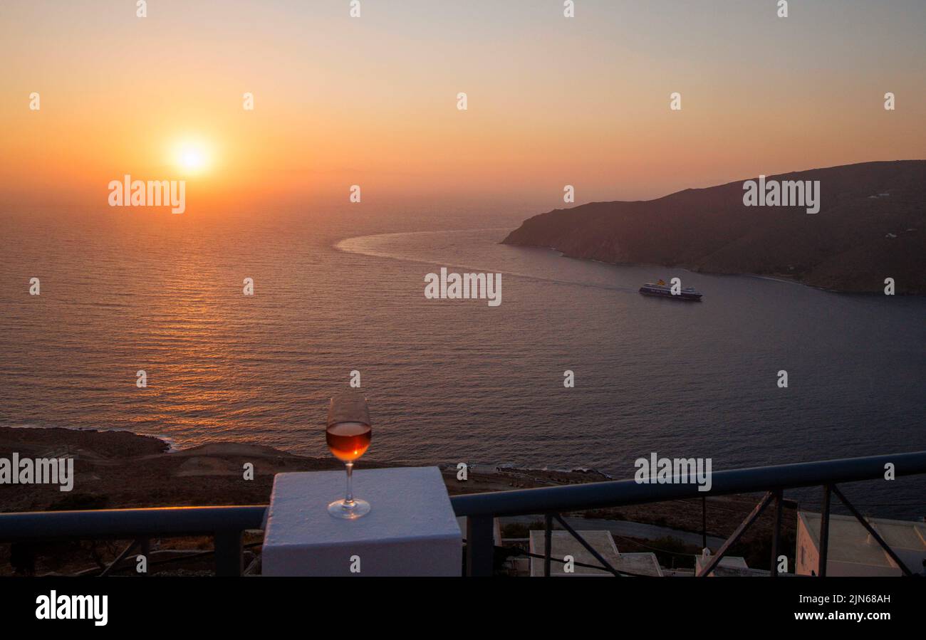 The Blue Star Naxos ferry arrives in the port of Aiyiali on Amorgos in Greece at sunset Stock ...