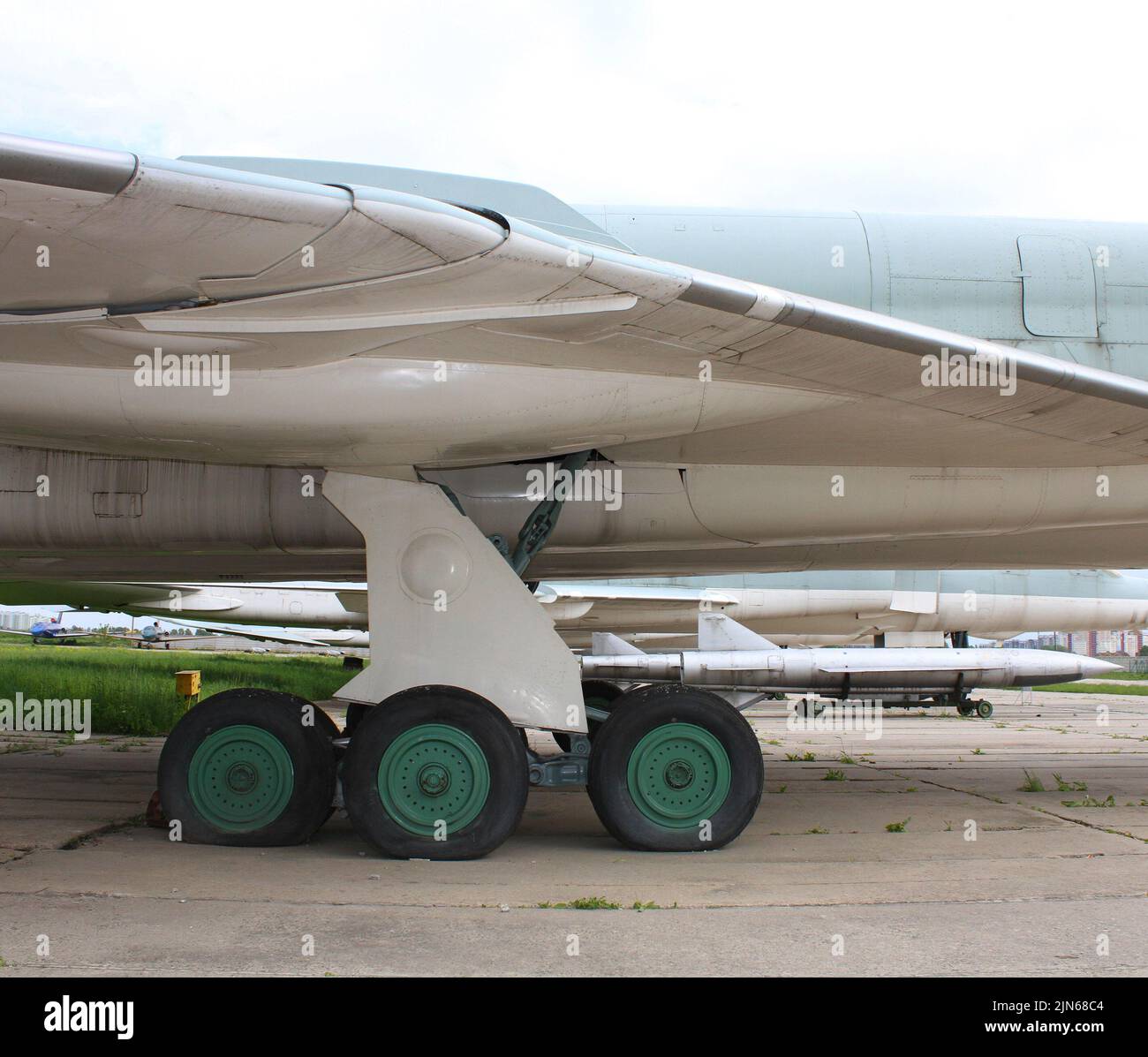 Air-launched missiles under the wing of a landed bomber at military air ...