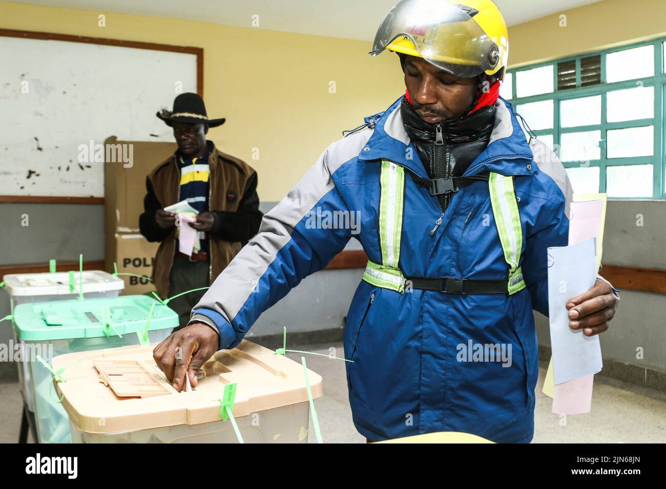 A voter casts his ballot at Nakuru Boys High School Polling Center ...