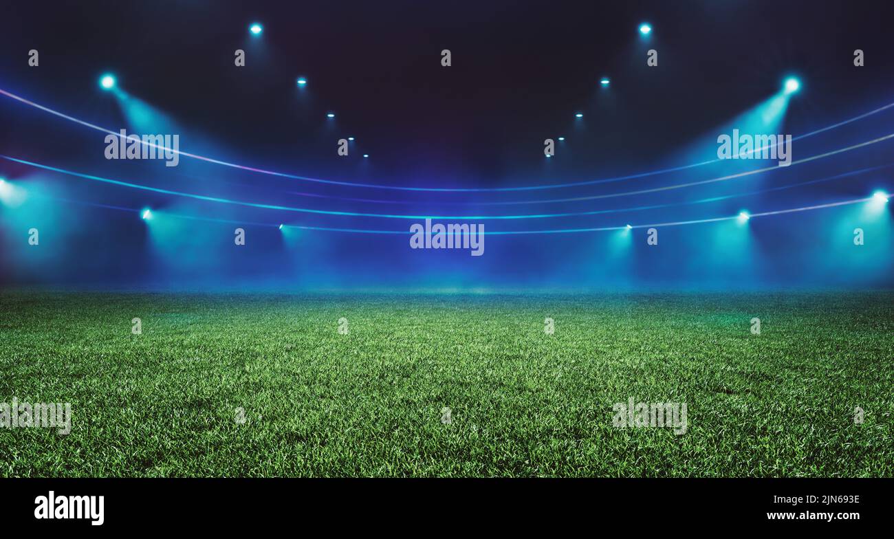 Grand football stadium green pitch view illuminated by spotlights and ...