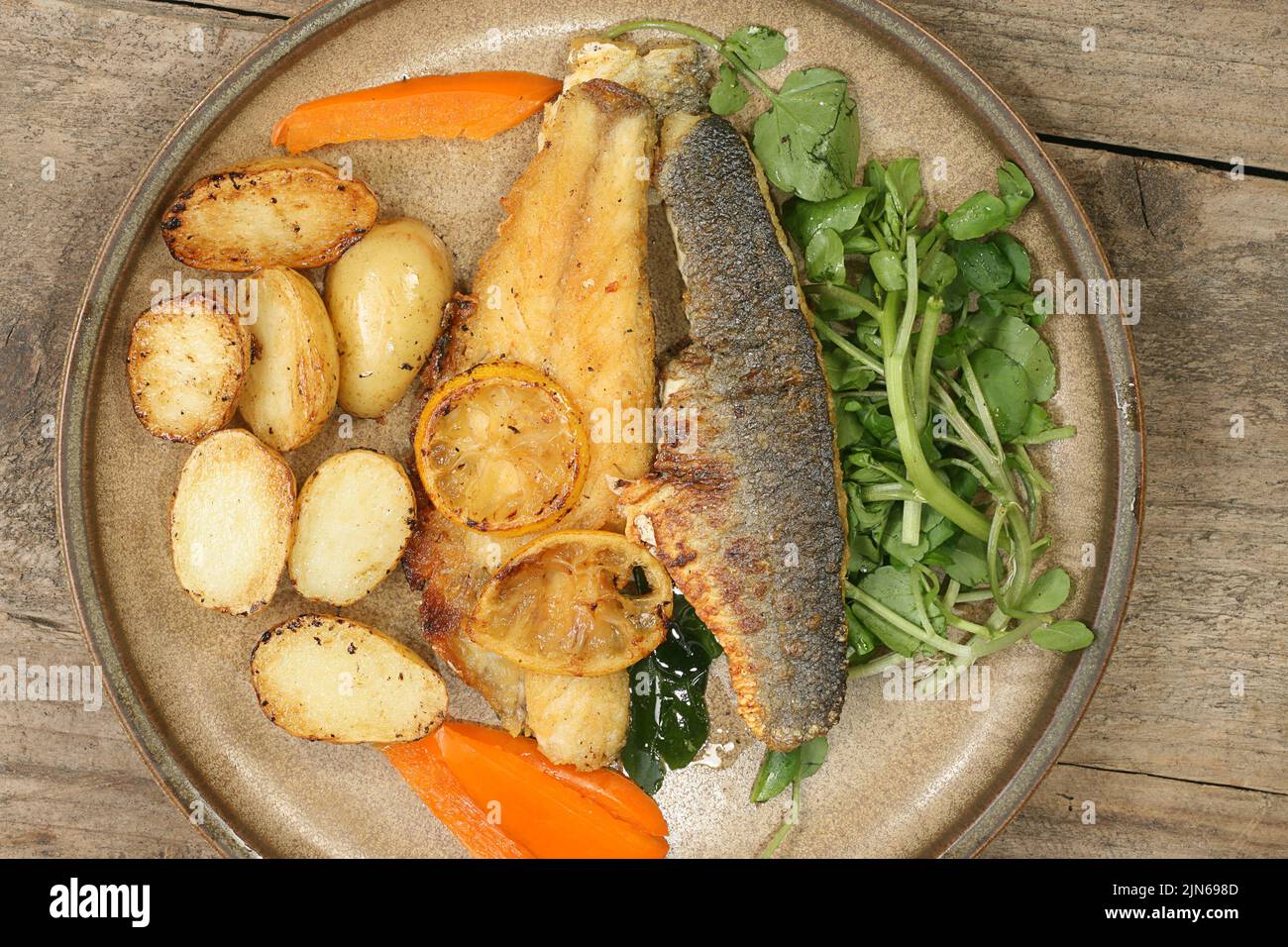 pan fried sea bass Stock Photo - Alamy