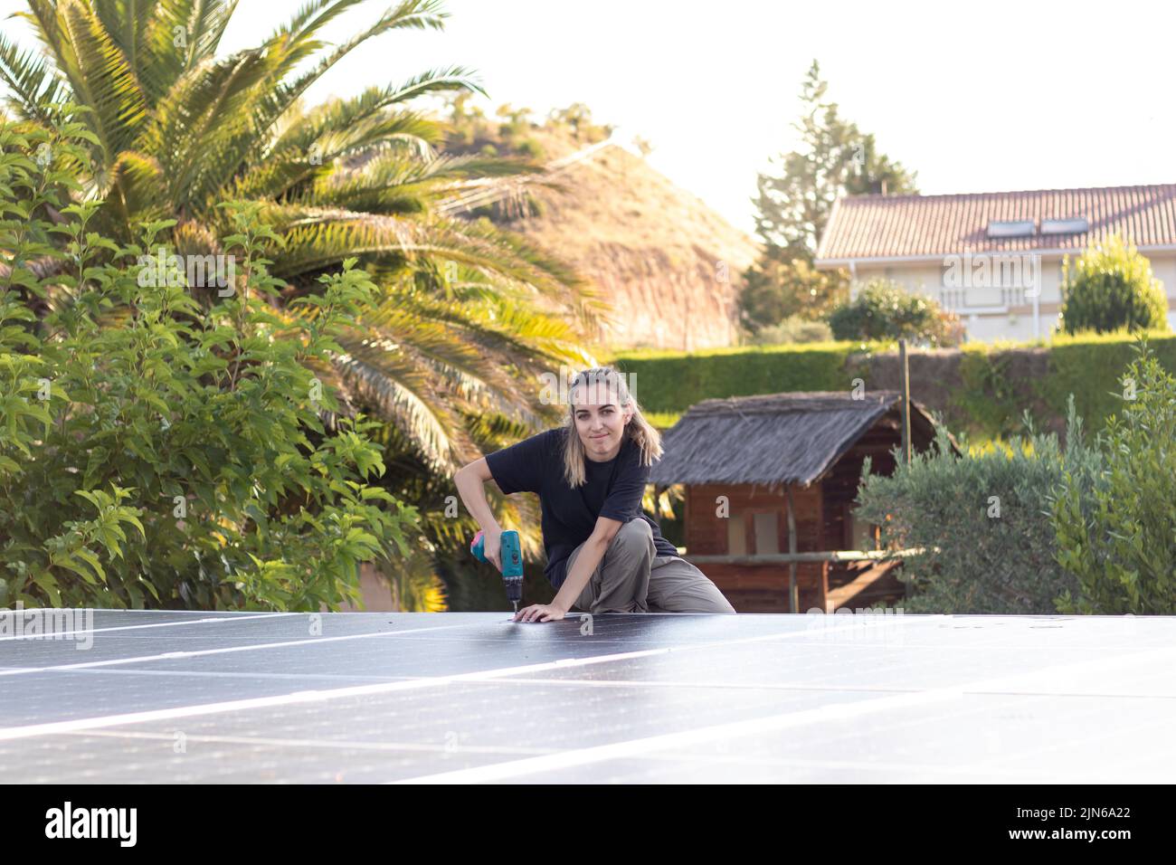 Young technician woman engineer working on a photovoltaic panels ...