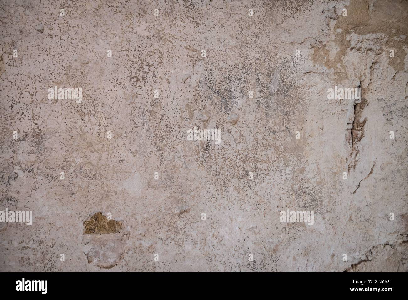 Background image of an old stucco wall that is very well aged and ...