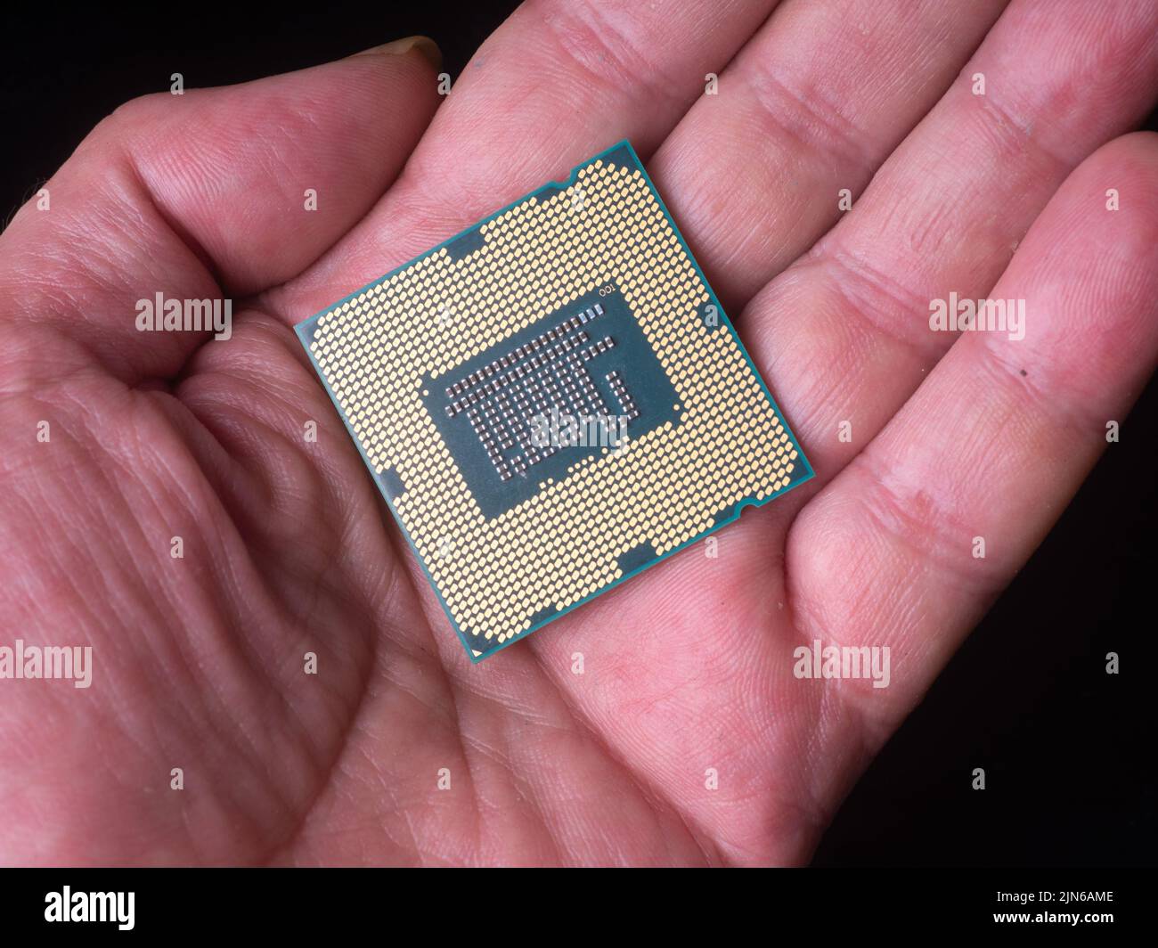 Computer Chip In One Hand Stock Photo - Alamy
