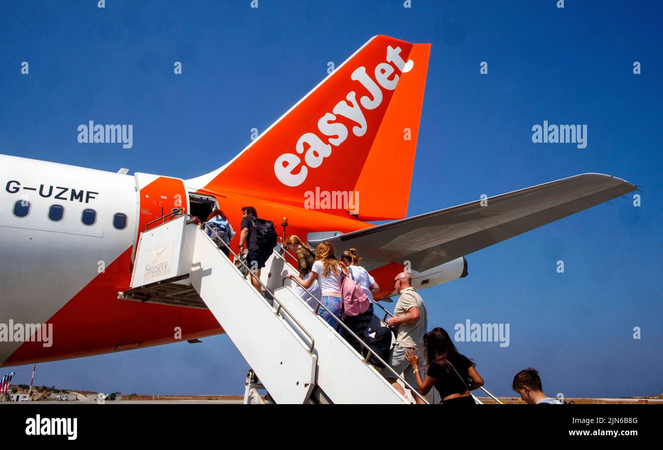 Passengers boarding an easyJet aircraft at Santorini airport Stock ...