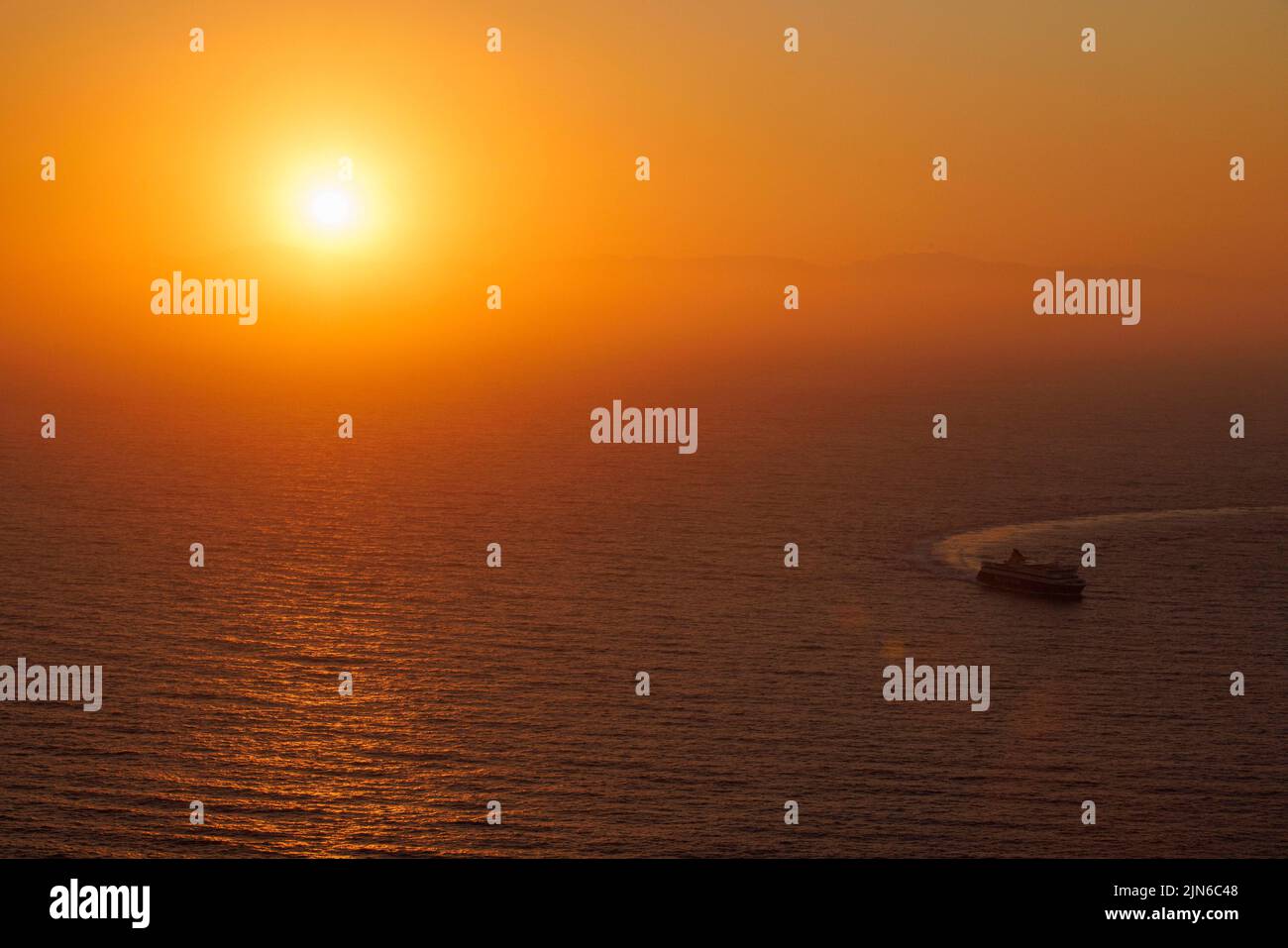 The Blue Star Naxos ferry arrives in the port of Aiyiali on Amorgos in ...