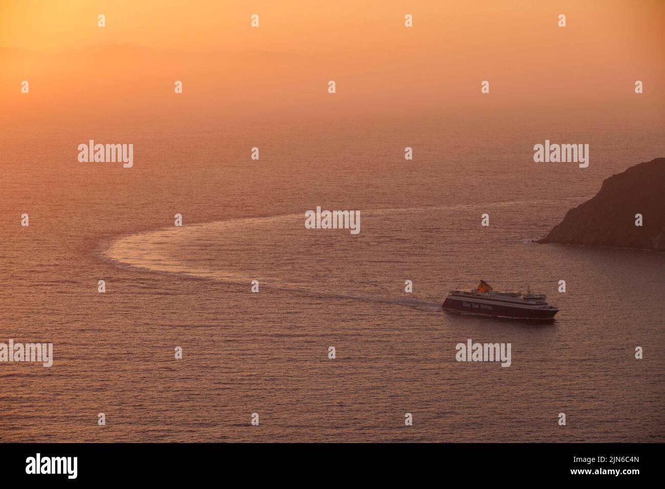 The Blue Star Naxos ferry arrives in the port of Aiyiali on Amorgos in ...