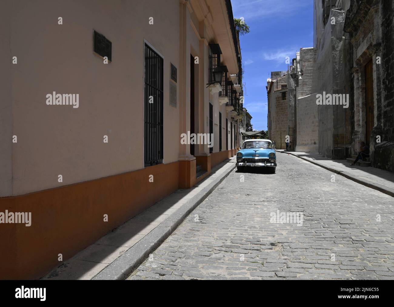 Cityscape with a vintage light blue and white sedan 1955 Chevrolet Bel ...