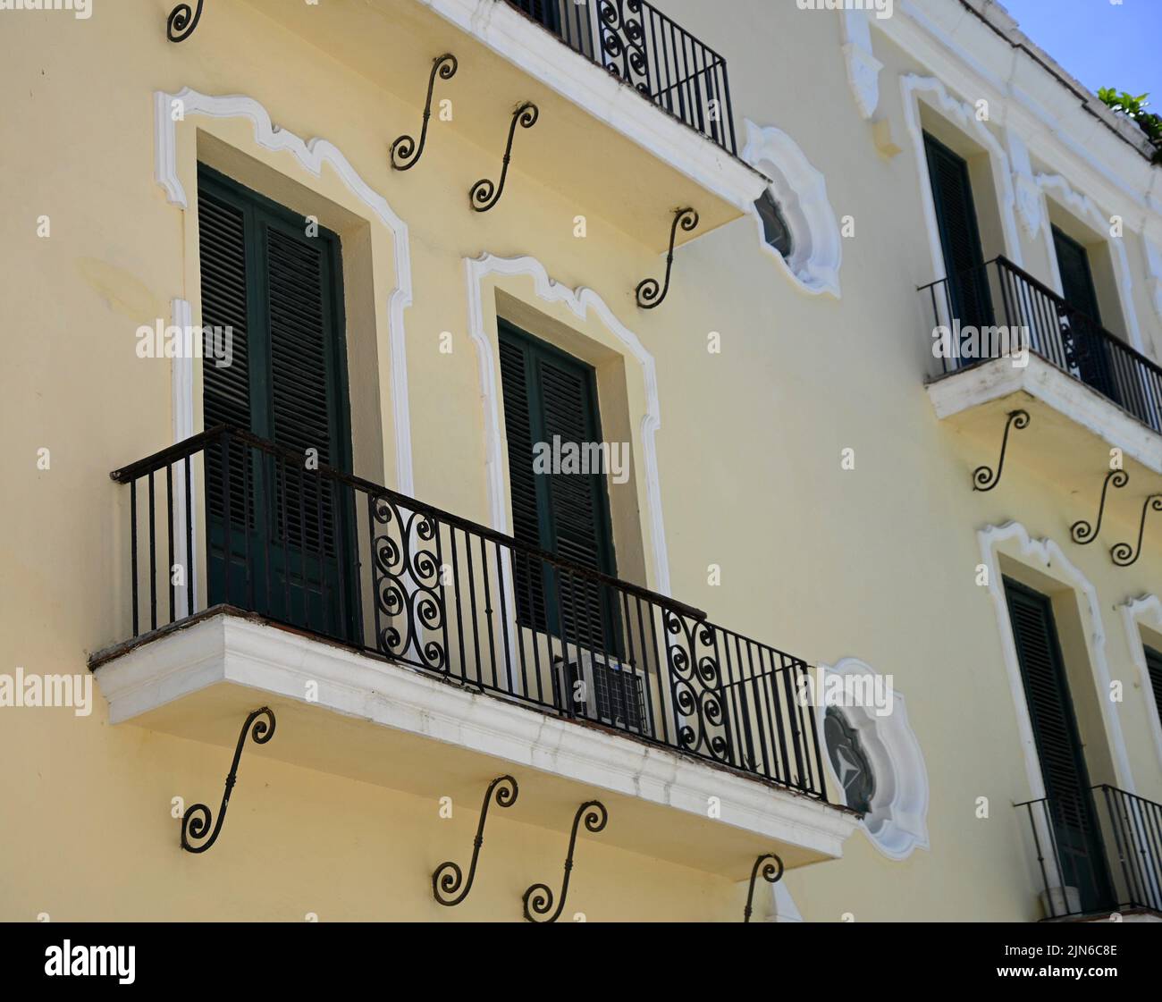 Scenic exterior view of a traditional Neoclassical building with wooden ...