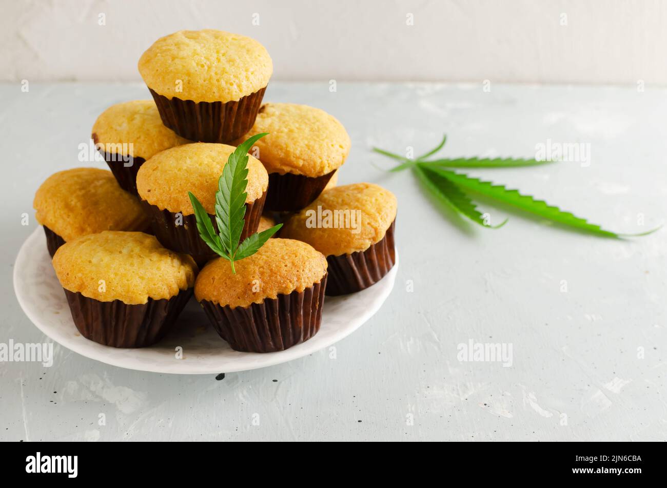 Many Marijuana cupcake muffins with cannabis leaves. Gluten free ...