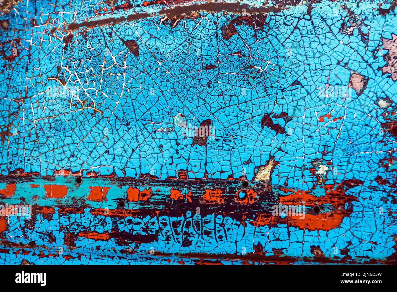 Enamelled colorful cracked and peeling surface of old motorcycle. Rusty ...