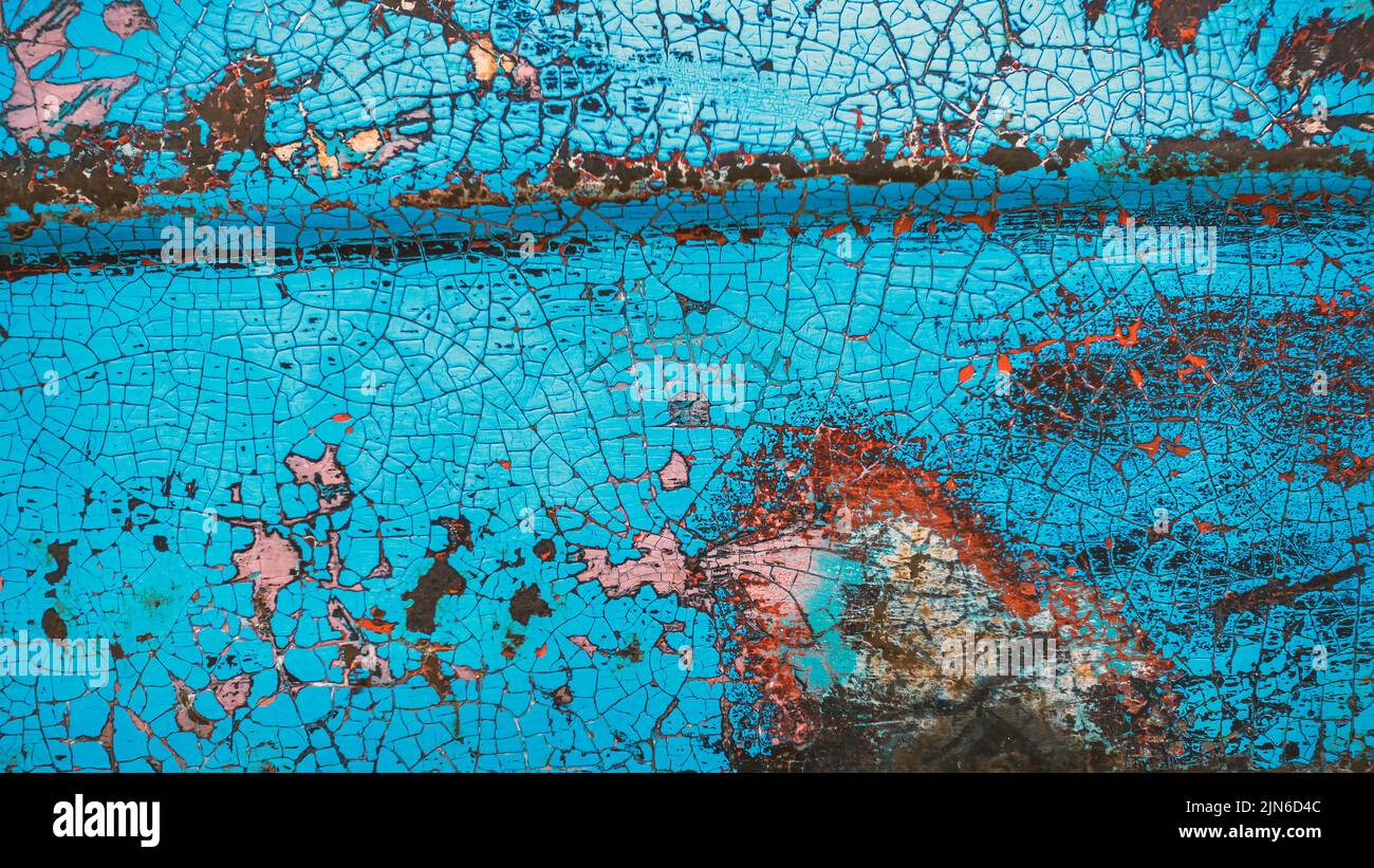 Enamelled colorful cracked and peeling surface of old motorcycle. Rusty ...