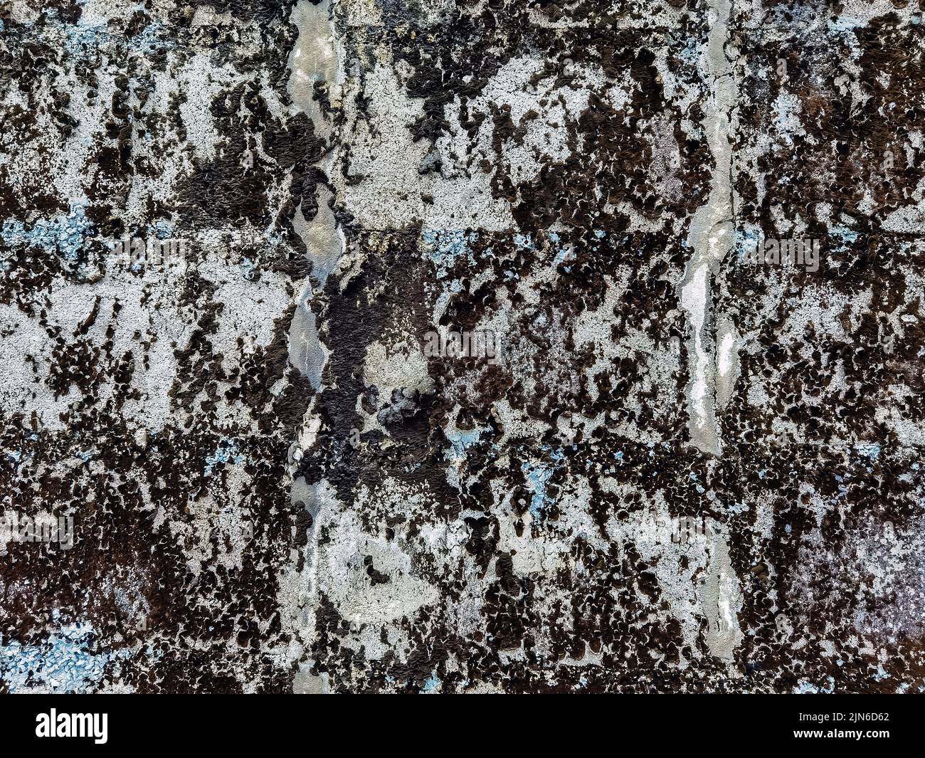 Dirty old eroded cracked plaster cement block fence. Concrete block ...