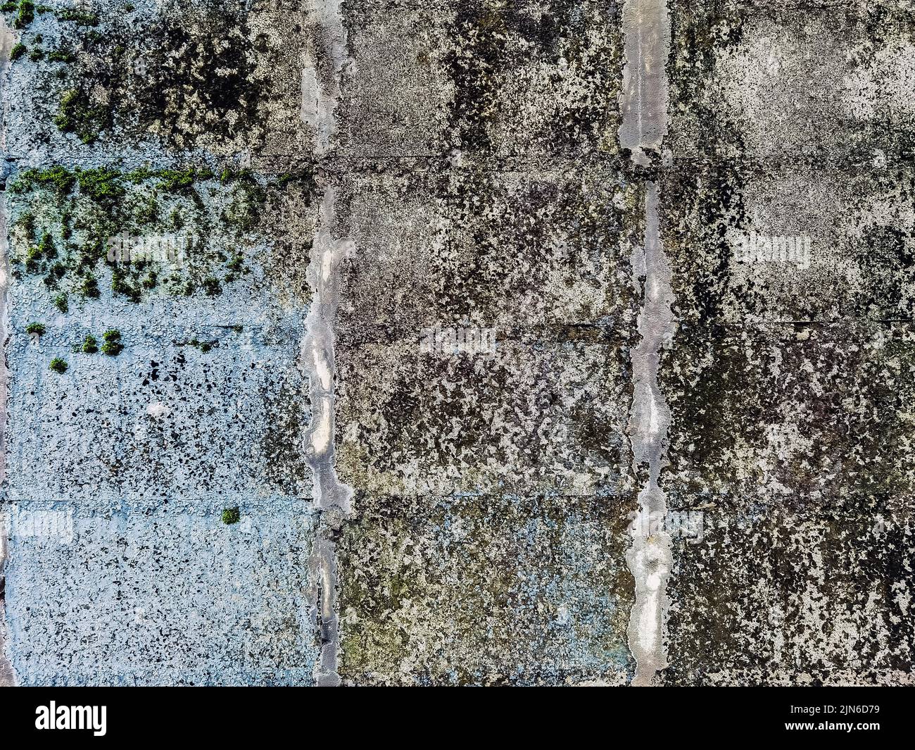 Dirty old eroded cracked plaster cement block fence. Concrete block ...