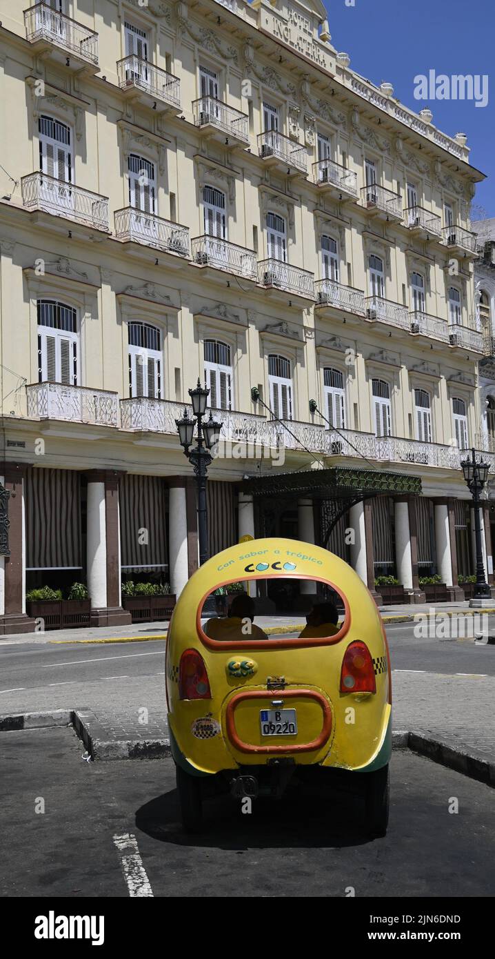Cityscape with scenic view of a typical Coco-taxi the traditional ...