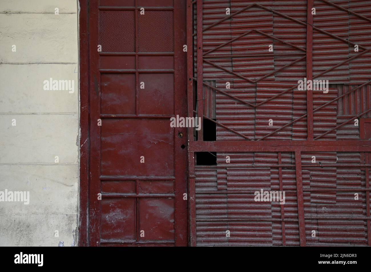 Old handcrafted metal door on a paneled stone wall in Old Havana, Cuba ...