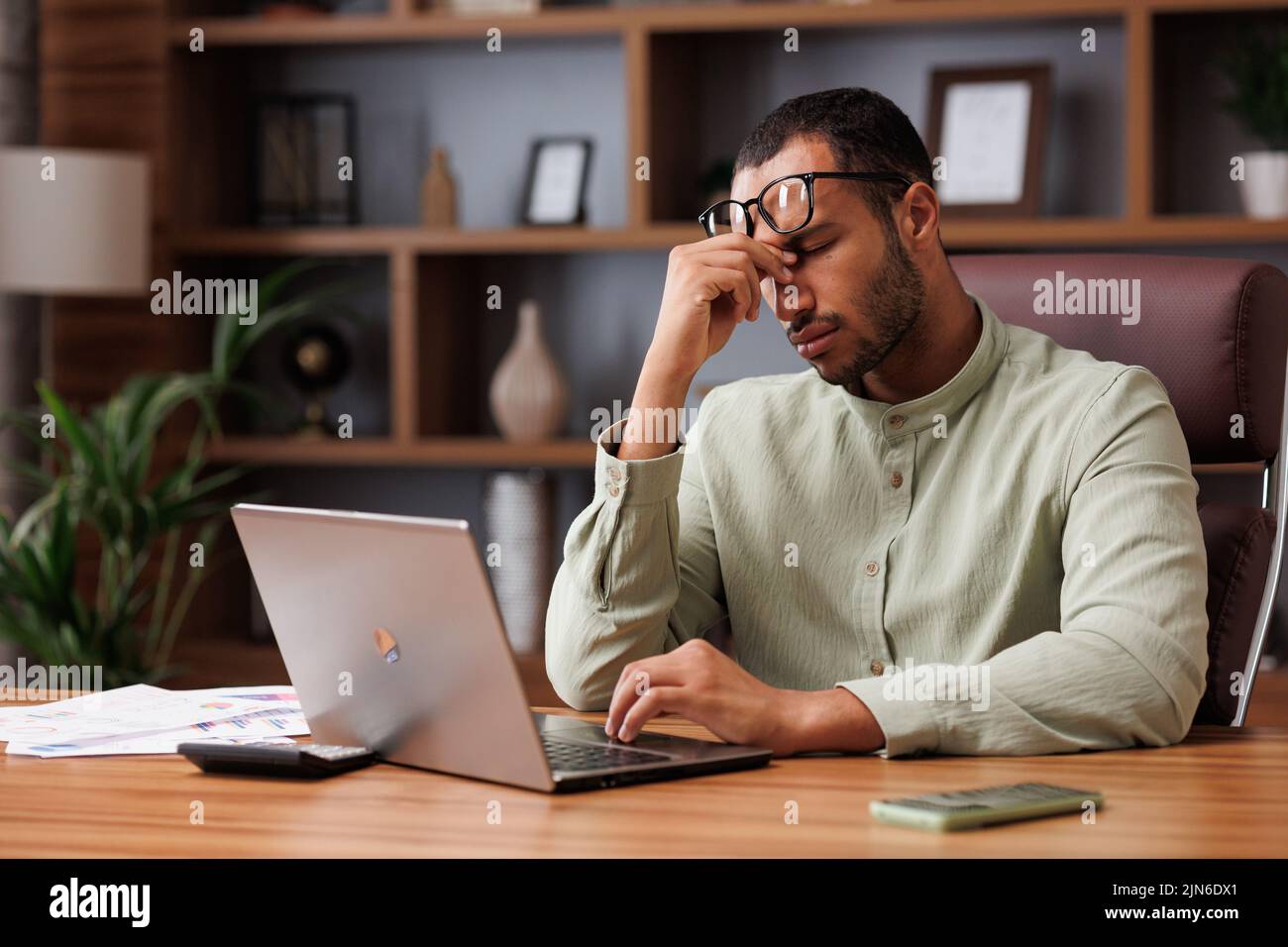 Tired african american businessman after exhausting paperwork taking ...