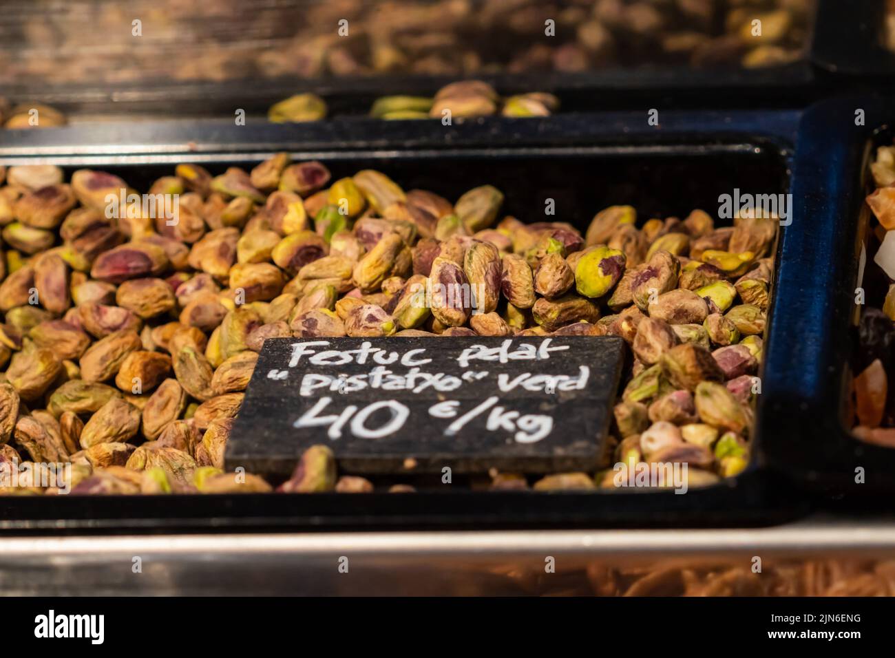 Peeled and salted pistachio on an aluminum tray in a Syrian market, on ...