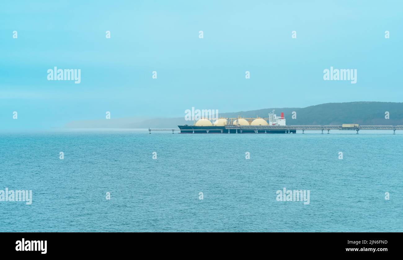 LNG carrier ship during loading at an liquefied natural gas offshore ...