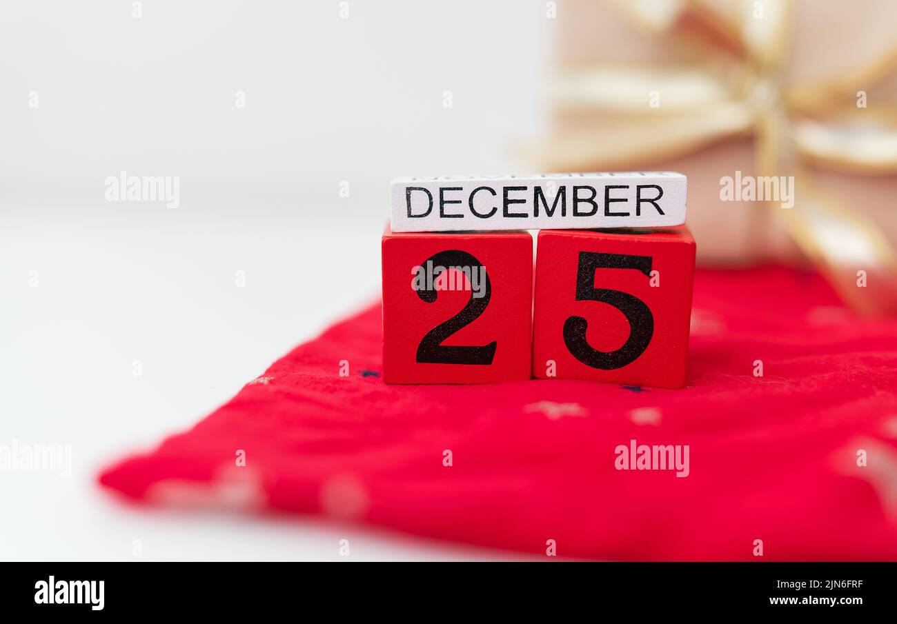 December 25 is lined with red cubes along with December lettering on a ...