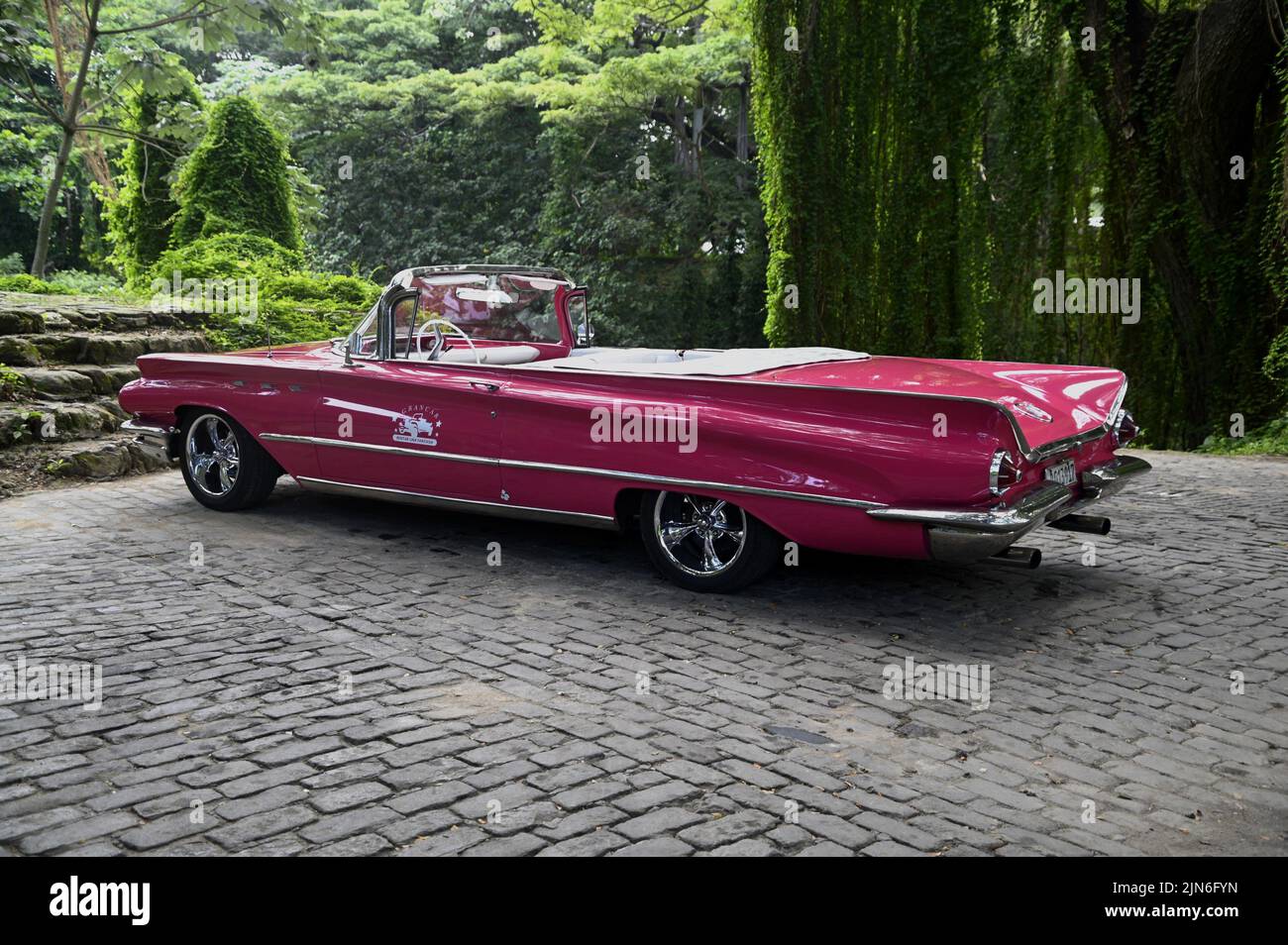 Vintage fuchsia pink 1956 Buick Le Sabre with polished chrome plated ...