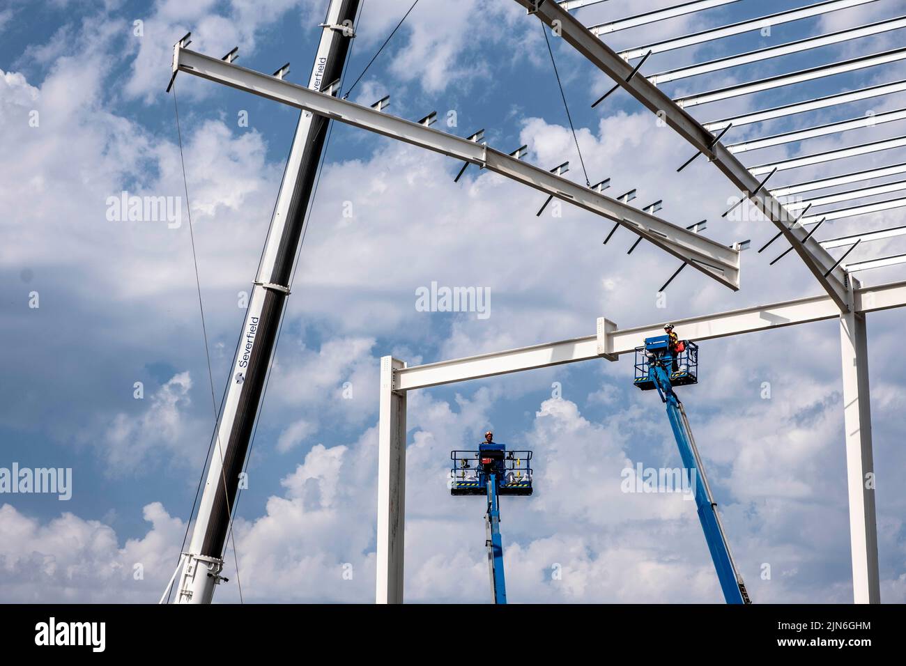 Building construction showing steel beams and working at height Stock ...