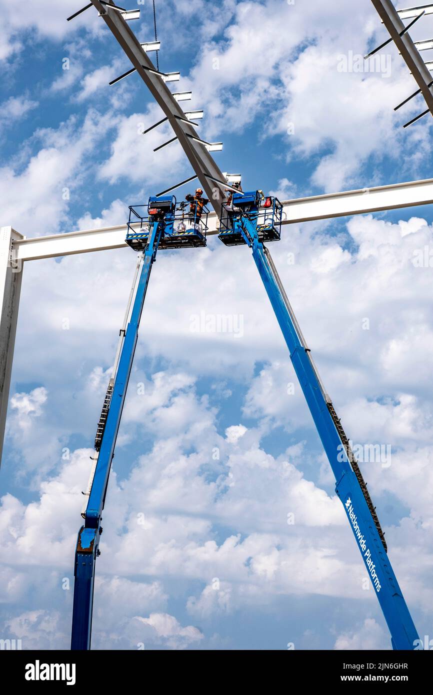 Building construction showing steel beams and working at height Stock ...