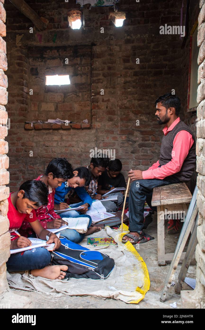 An indian village school teacher giving training to school kids Stock ...