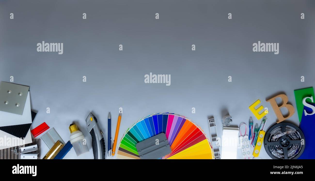 Advertising agency tools, construction materials and samples on silver ...