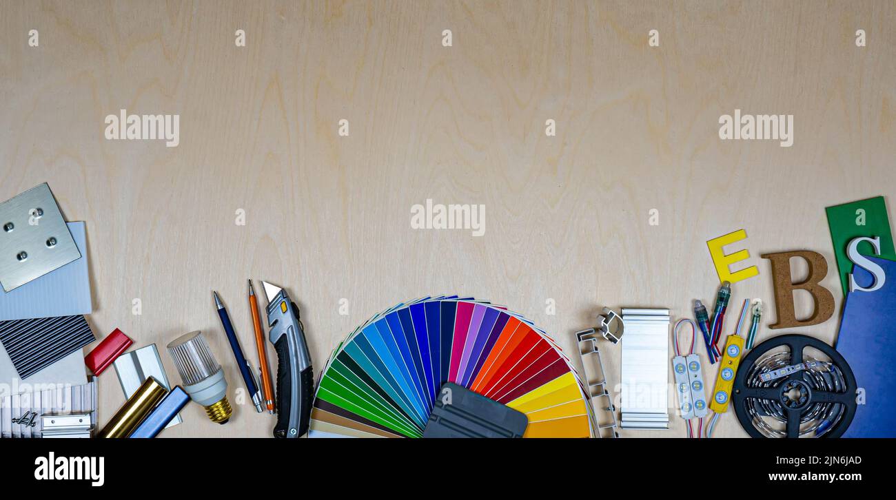 Advertising agency tools, construction materials and samples on plywood ...