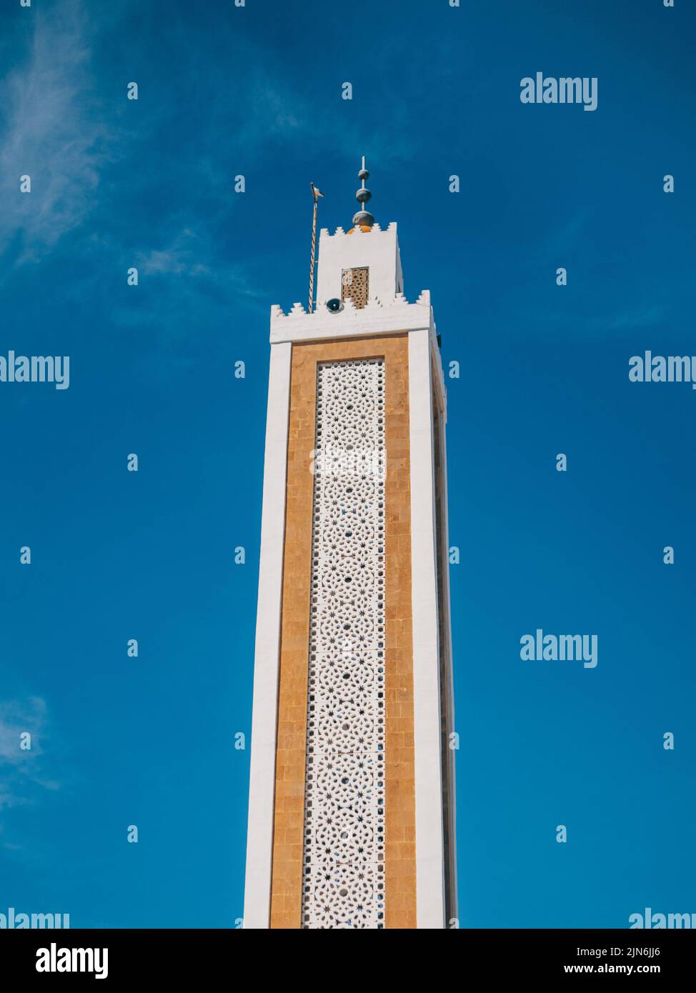 A vertical low angle shot of the beautiful Great Mosque of Tangier ...