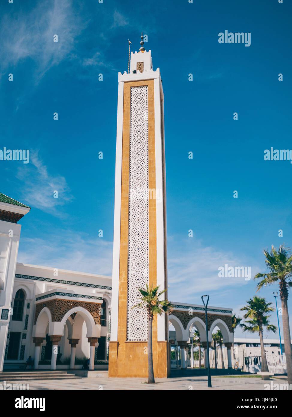 A vertical low angle shot of the beautiful Great Mosque of Tangier ...