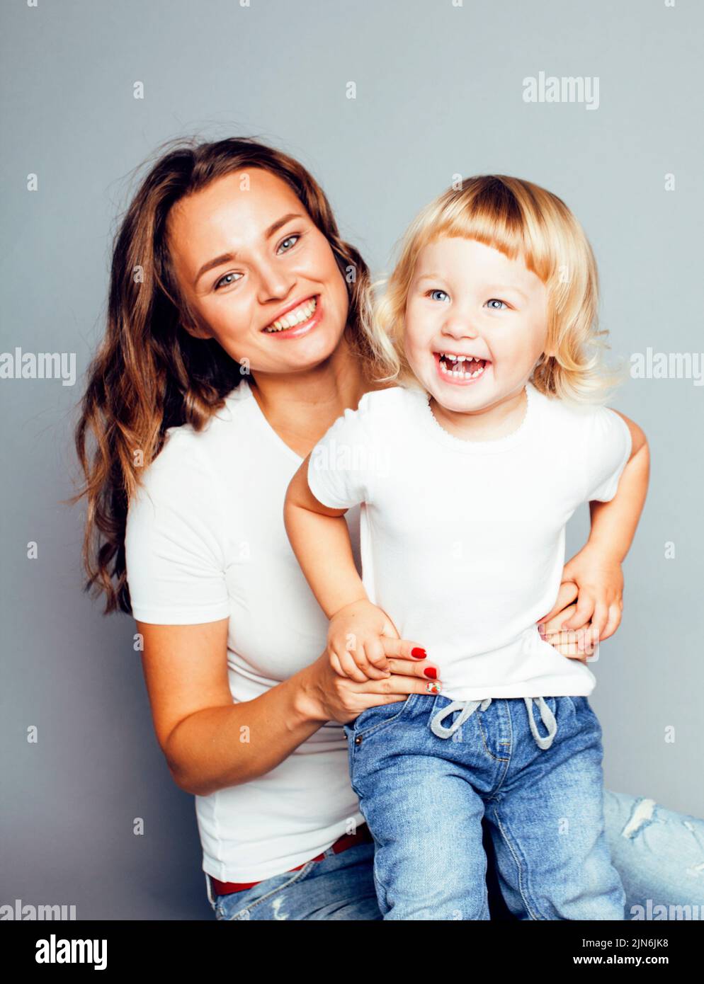 bright picture of hugging mother and daughter happy together, smiling ...