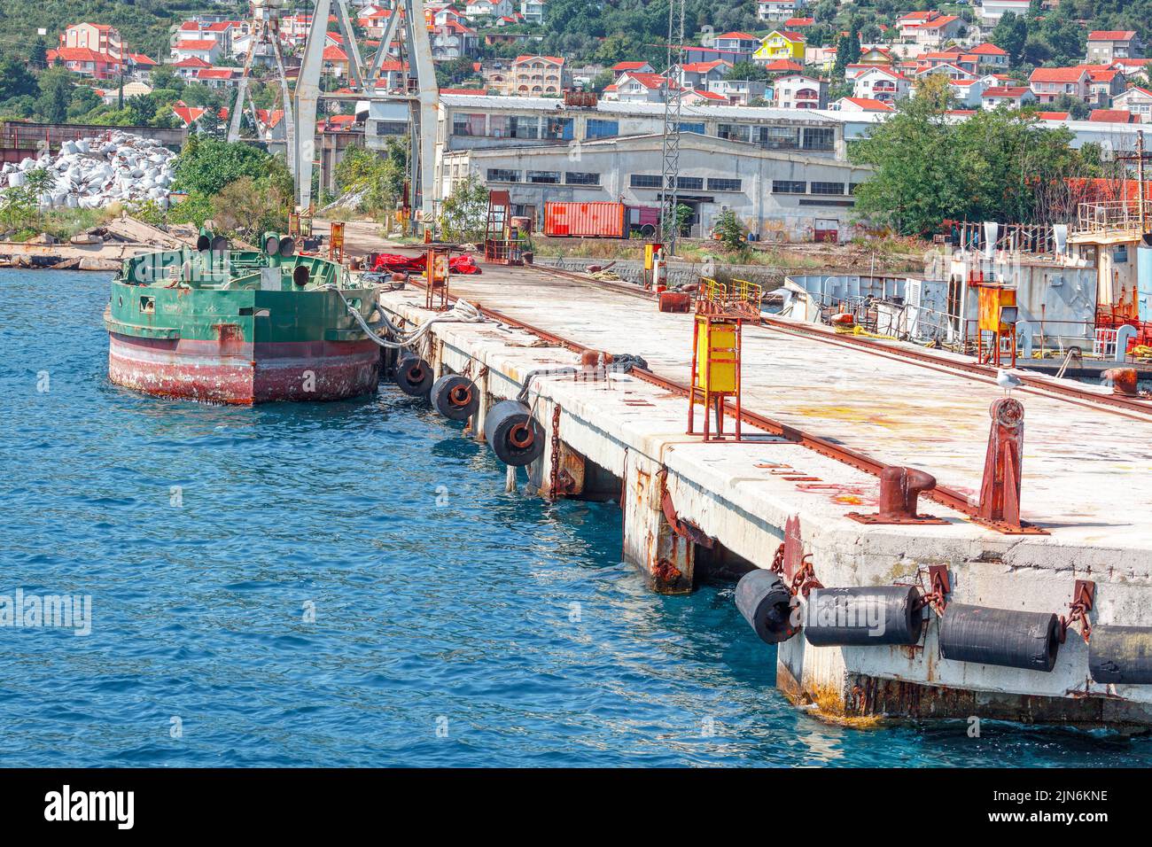 Industrial port and boat . Old harbor at Kotor Bay in Montenegro Stock ...