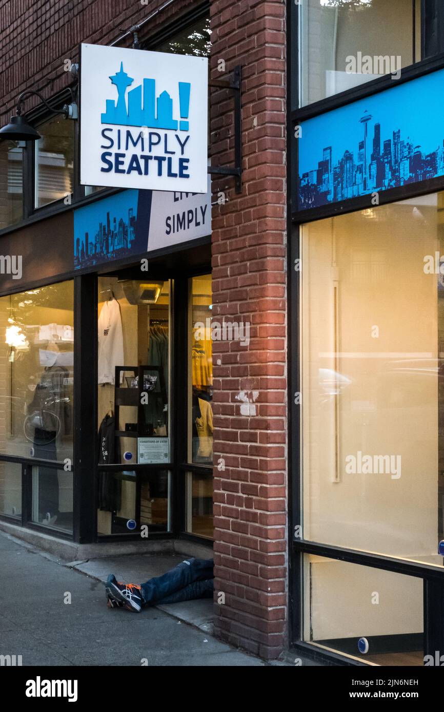 Seattle, USA. 3 Aug, 2022. A person sleeping in the doorway of Simply ...