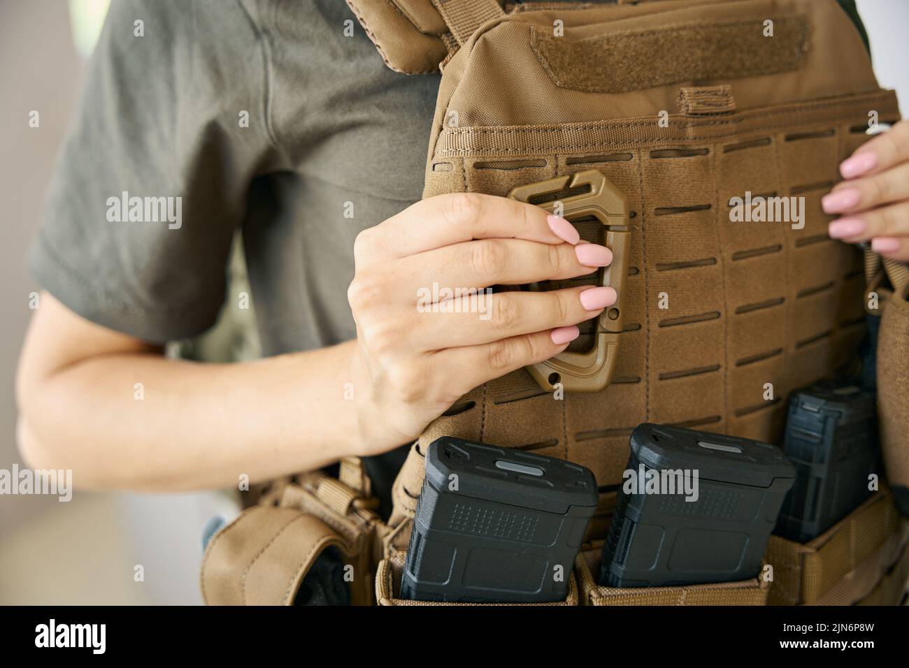 Woman soldier is wearing protective body armor and weapon set Stock ...