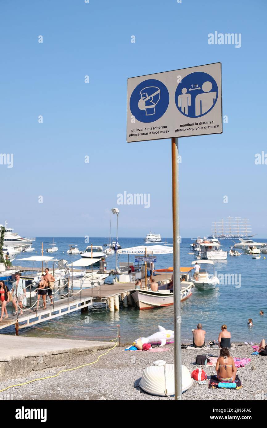 Covid information warning signs at Positano village beach front Italy ...