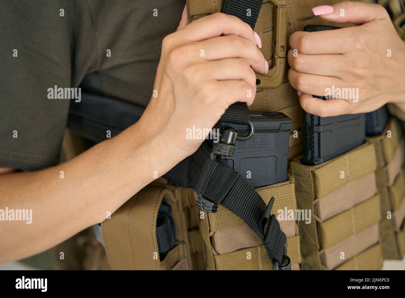 Military woman in a bulletproof vest and with a weapon Stock Photo - Alamy