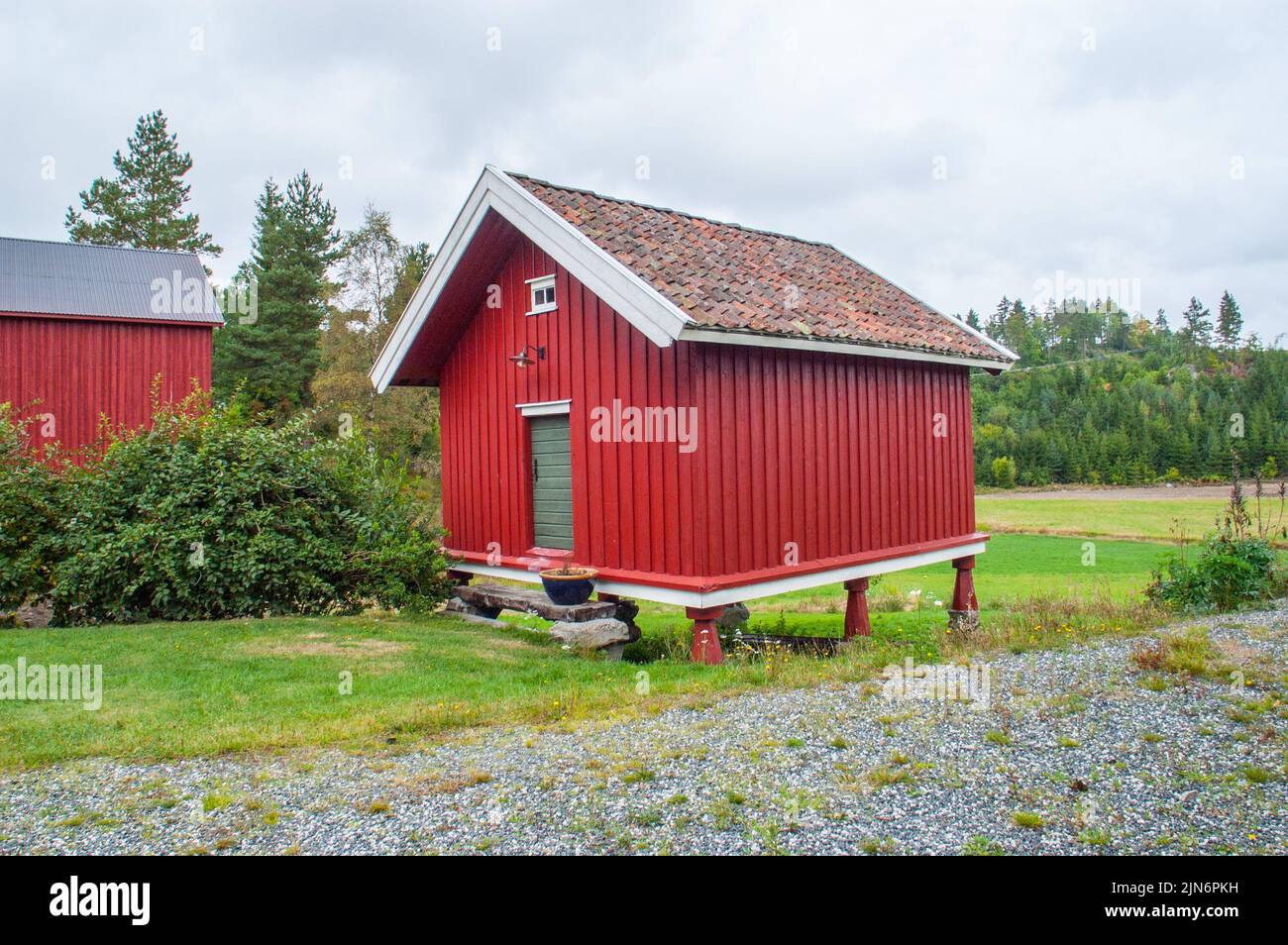 An old, traditional red storehouse on a farm Stock Photo - Alamy