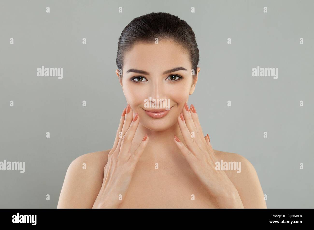 Happy model woman holding perfect hands with manicure on white ...