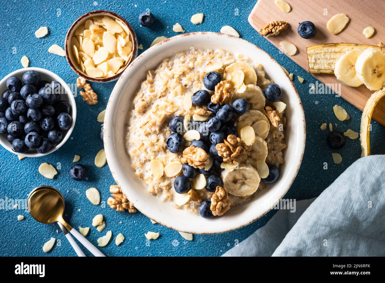 Oatmeal porrige in craft bowl at white background Stock Photo - Alamy