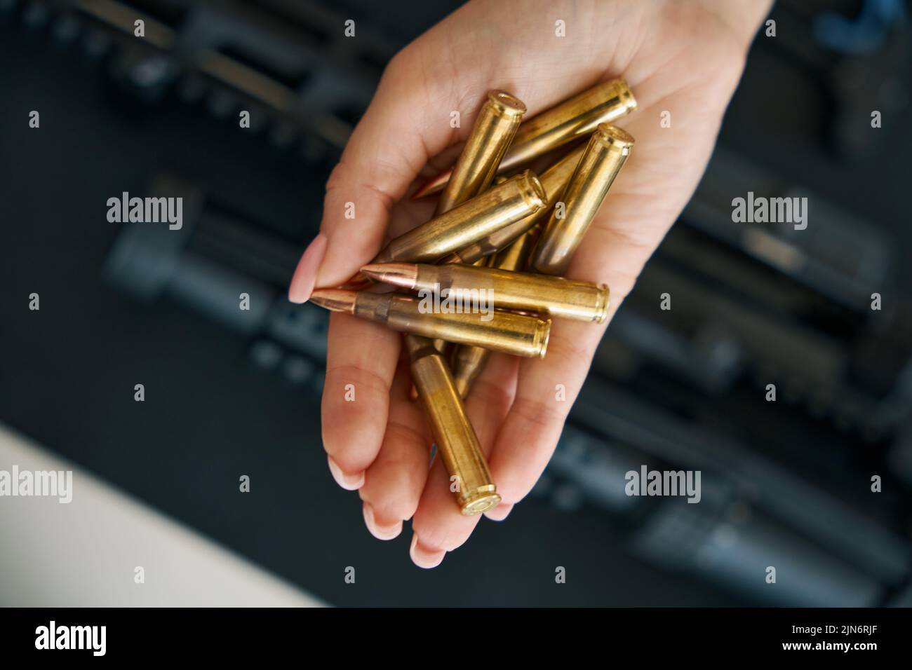 Hand holding bullets cartridge bullet hi-res stock photography and ...