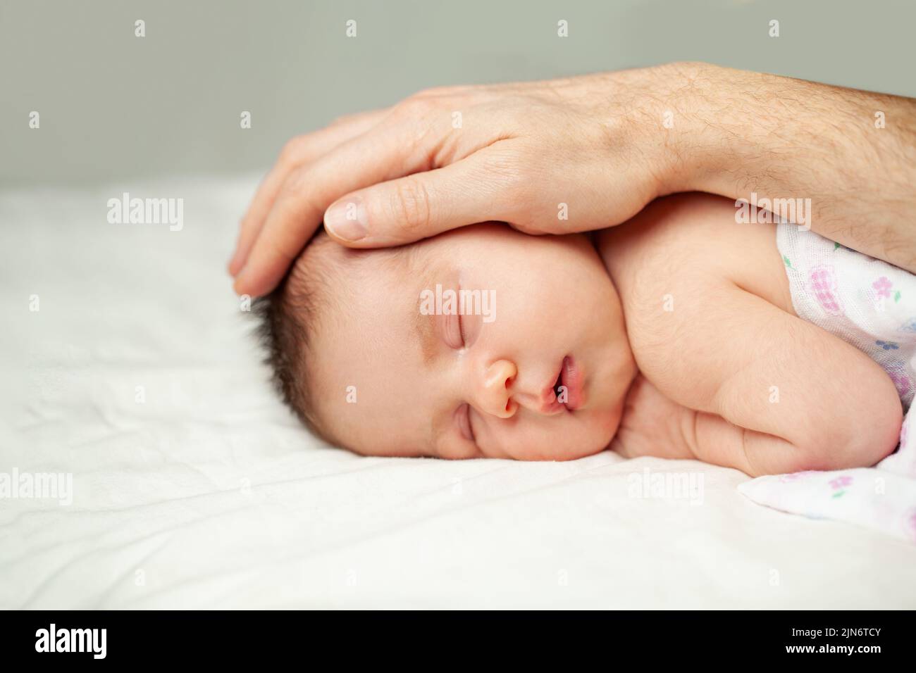 Small newborn baby and daddy's hand Stock Photo - Alamy