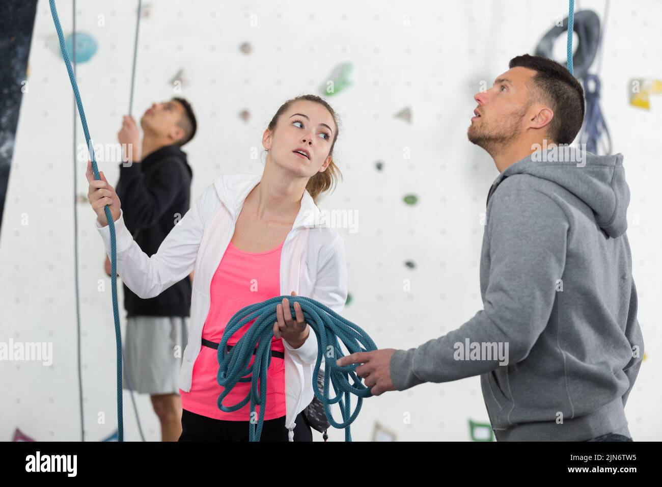 woman and man with ropes on the climbing gym Stock Photo - Alamy