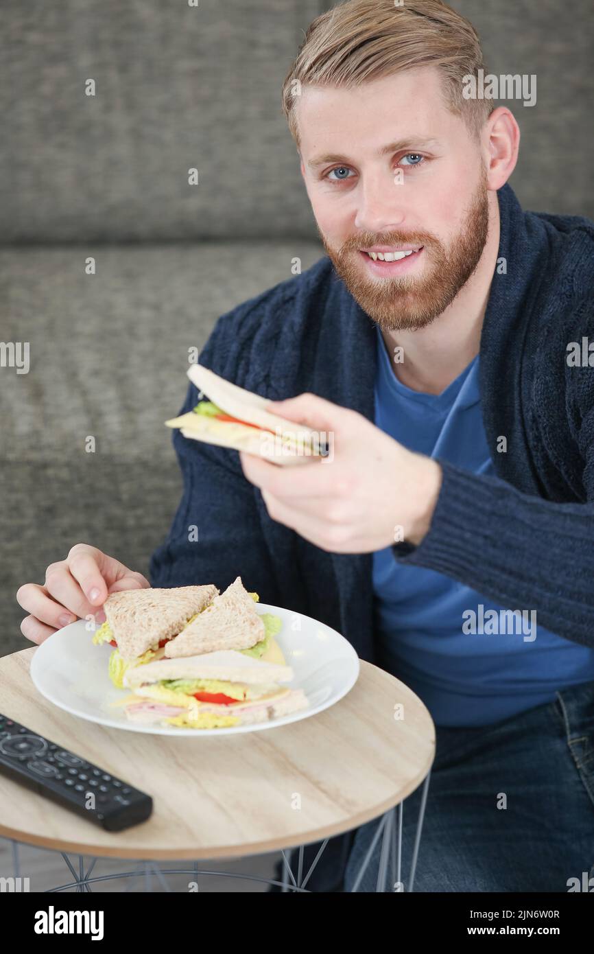 Man eating hamburger street hi-res stock photography and images - Alamy