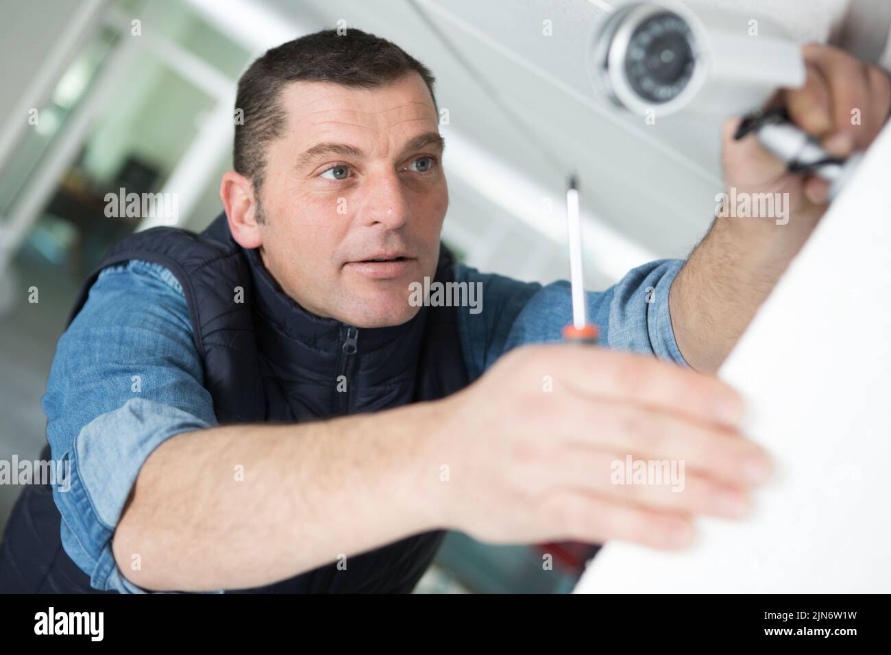 Repairing cctv hi-res stock photography and images - Alamy
