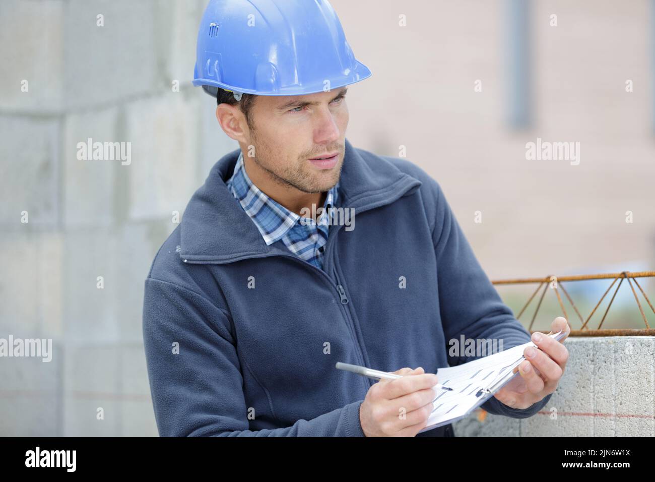 checking the state of a wall house at construction site Stock Photo - Alamy