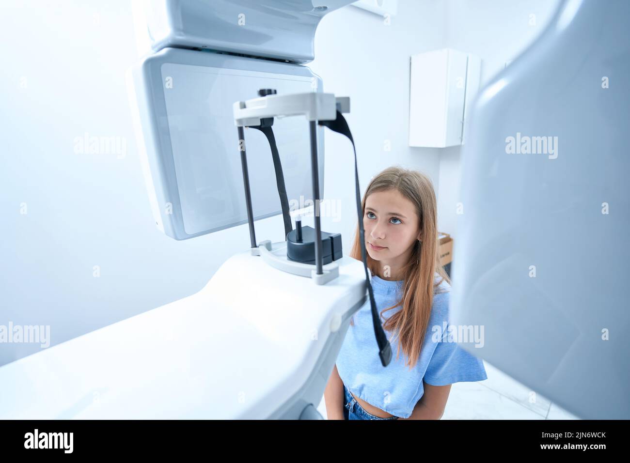 Tranquil teenage girl before panoramic radiography procedure Stock ...