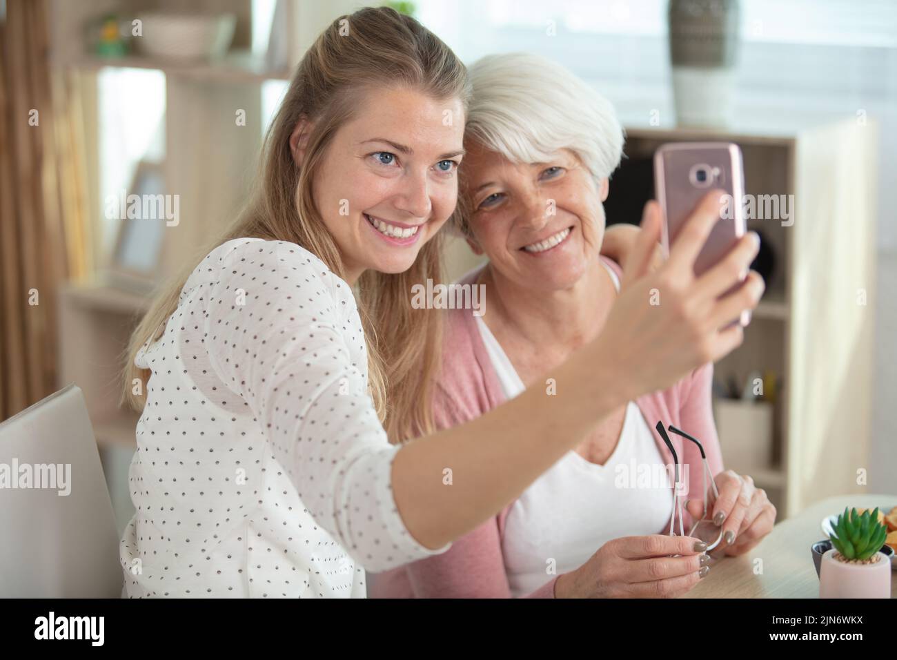 happy daughter is taking photo with parent Stock Photo - Alamy
