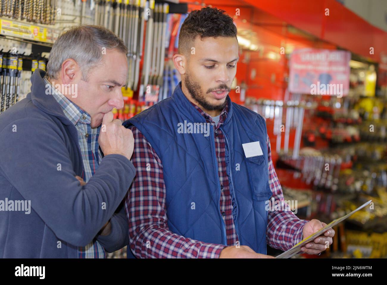 customer listening to a hardware vendor Stock Photo - Alamy